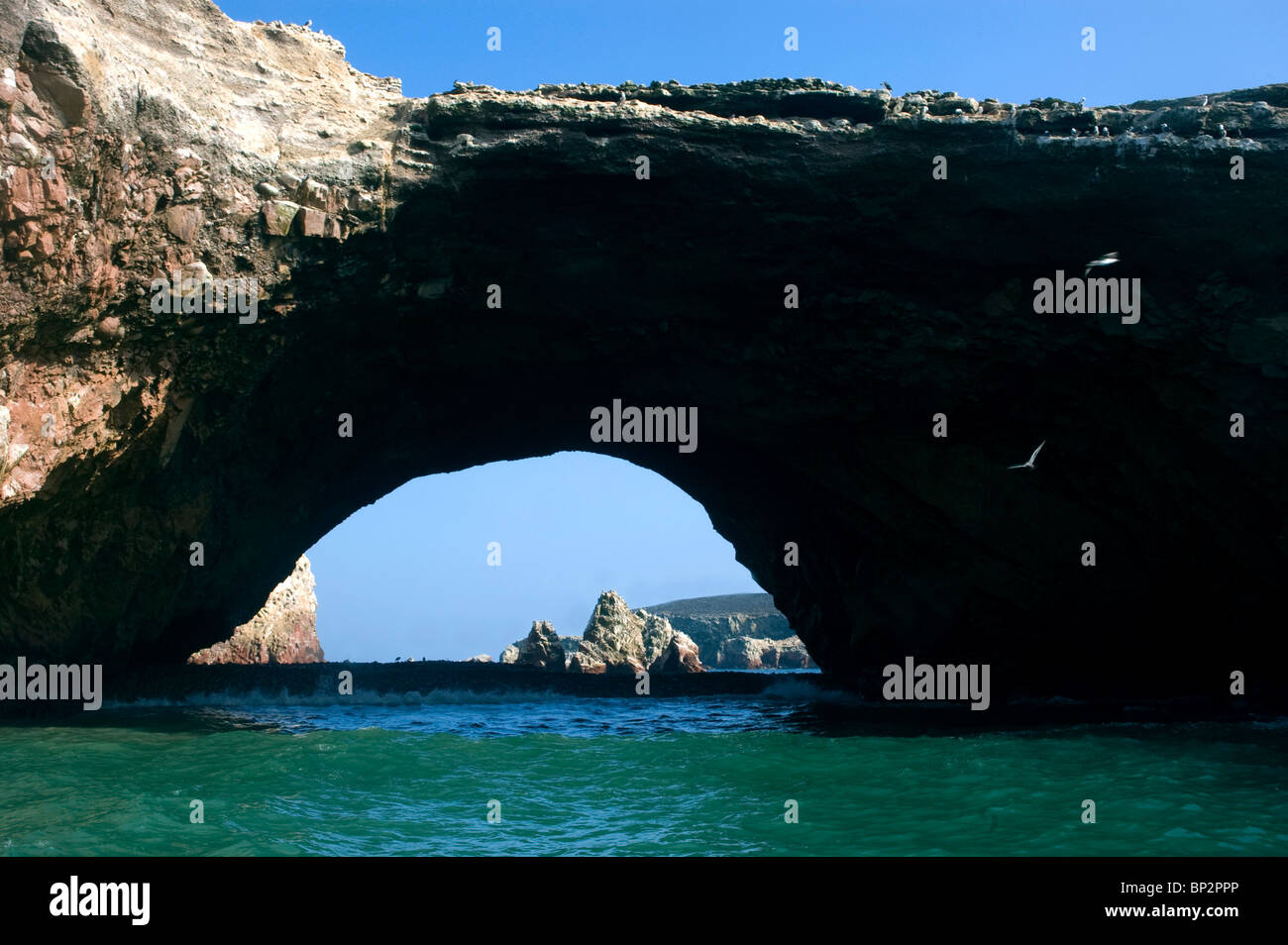 An arch at the guano islands of Ballestas, Reserva Nacional de Paracas ...