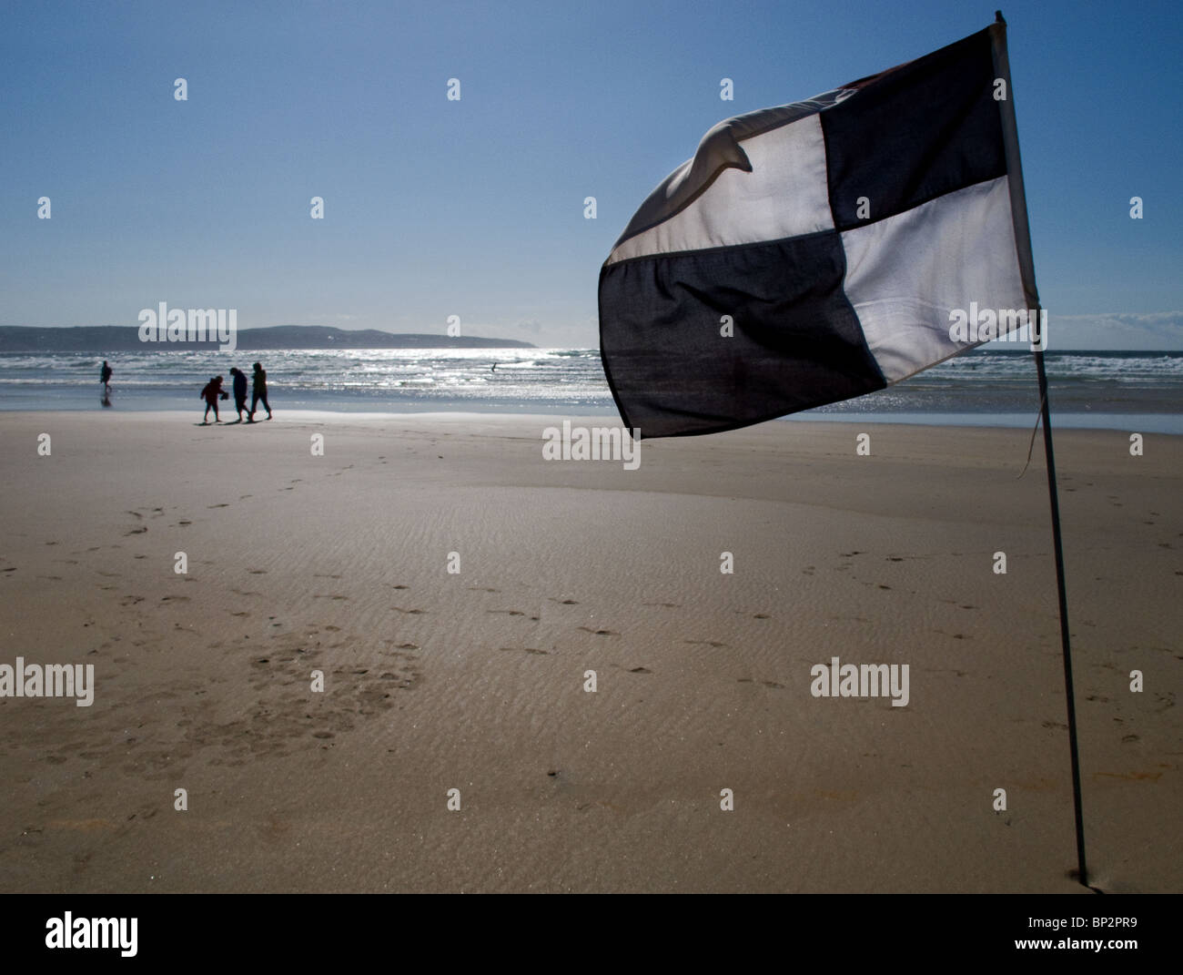 A lifeguard safety flag on Gwithian beach in Cornwall. Photo by Gordon ...