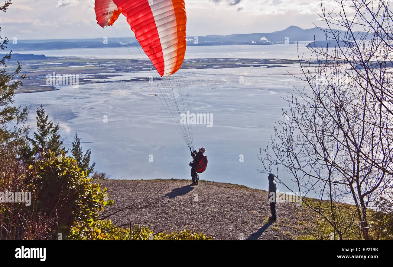 Hang glider is getting ready to jump off a cliff at Blanchard Mountain ...