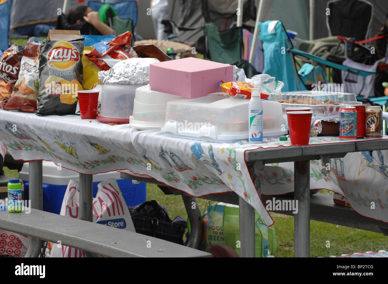 Picnic with table piled with food Stock Photo - Alamy