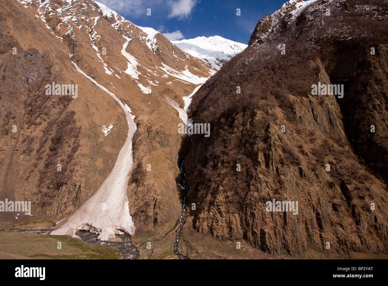 Snowy valley in the Great Caucasus, near Kazbegi; Georgia Stock Photo ...