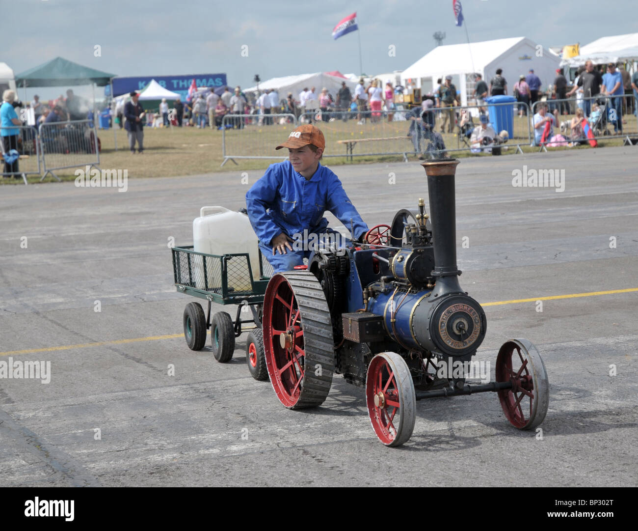 a young boy showing off his engine he helped build in the show ring at ...