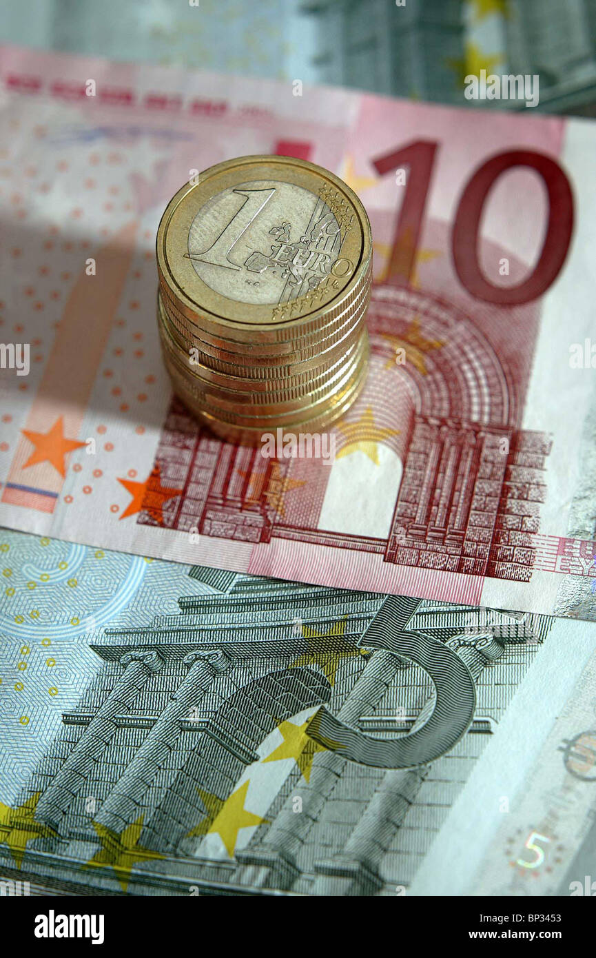 Euro notes and coins. Picture by James Boardman Stock Photo - Alamy