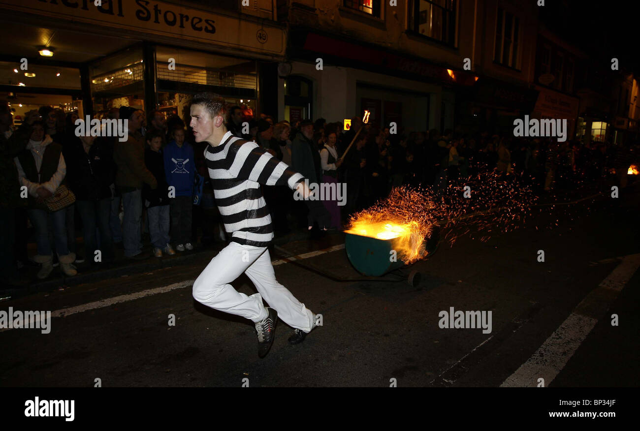 A member of Cliffe Bonfire Society races down the street with a burning ...