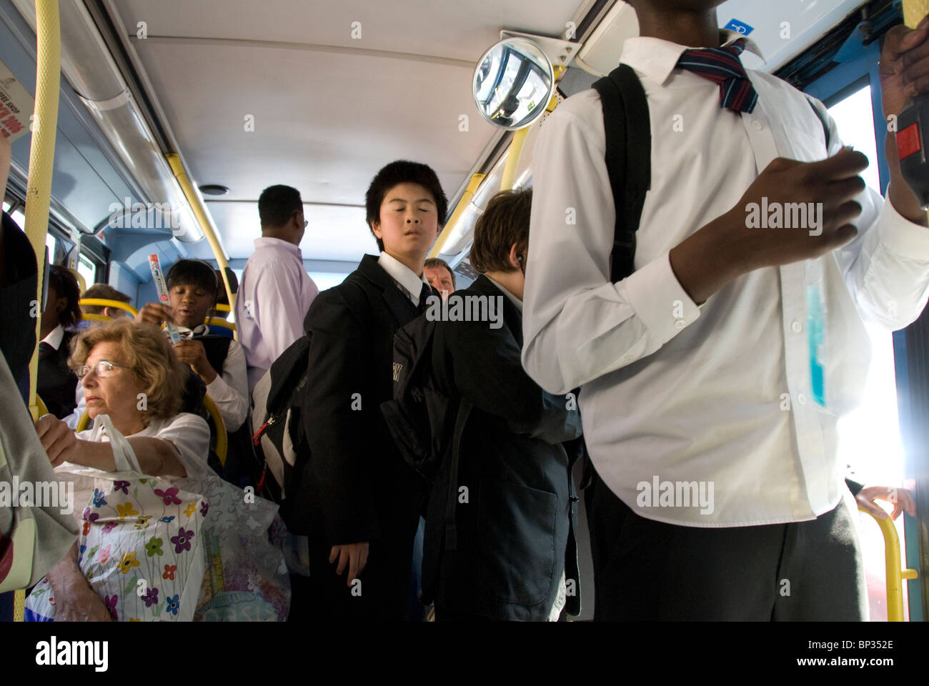 School children travelling home on public bus london Stock Photo - Alamy