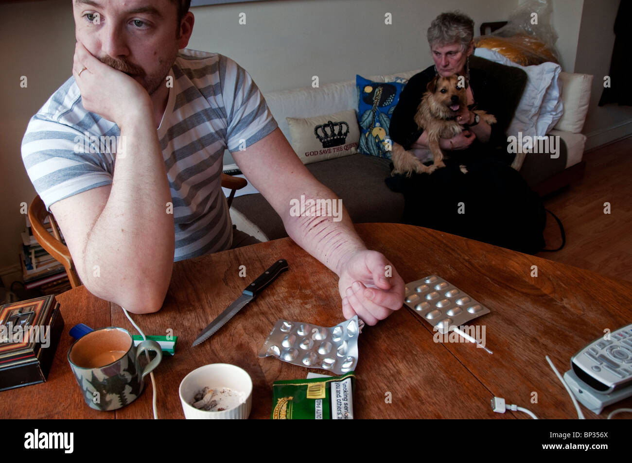 Extremely depressed young man self harming and suicidal Stock Photo - Alamy