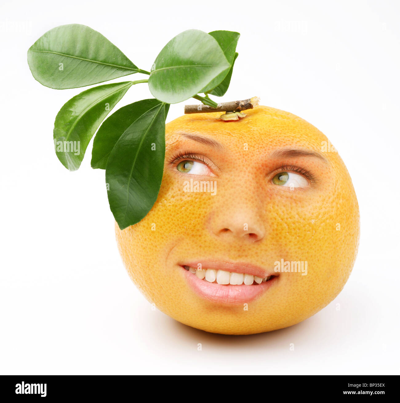 Ripe grapefruit with a person smiling girl. Computer assembly. On a ...