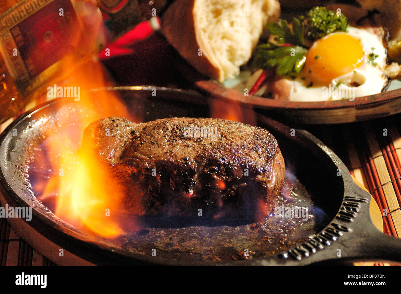 beef steak flambé by the table Stock Photo - Alamy