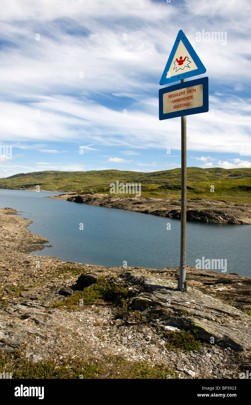Sign warning of the dangers of swimming in a regulated reservoir ...