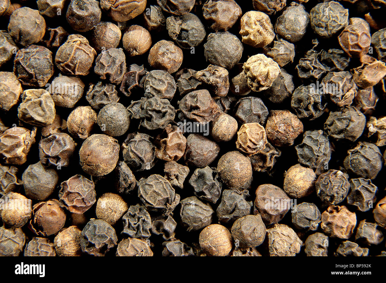 Texture Black pepper balls isolated Stock Photo - Alamy