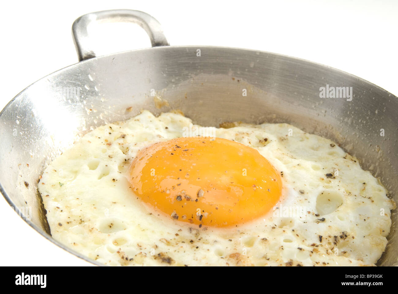 The egg on the silver pan Stock Photo - Alamy