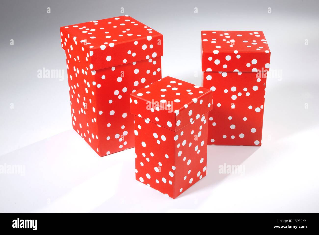 Three red Valentine boxes w white spots Stock Photo - Alamy