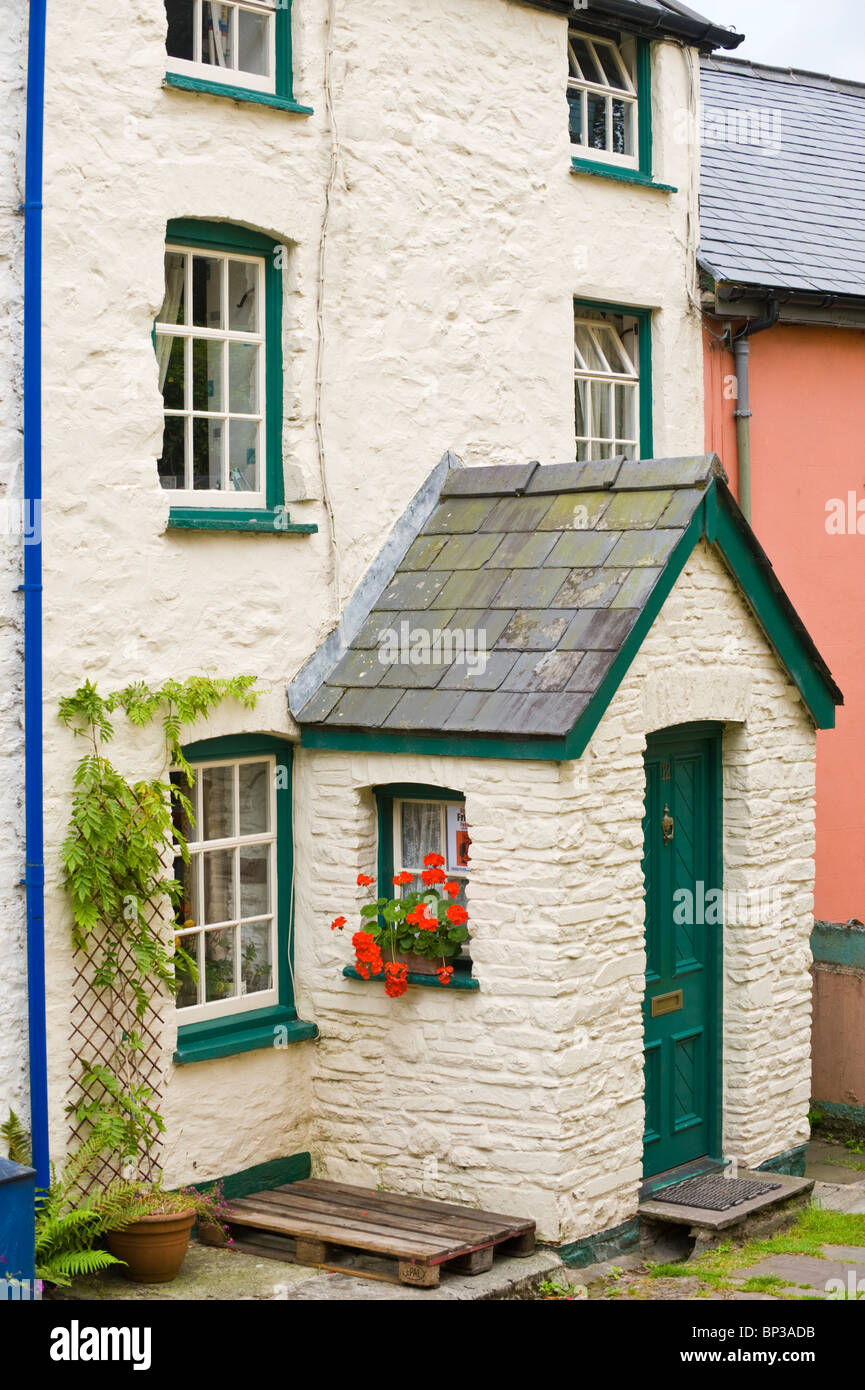 Porch with green painted wooden paneled front door no. 12 with knocker ...