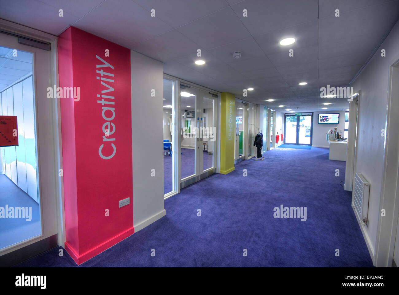 Knights Enham Infant and Junior Schoolbrightly coloured corridor Stock ...
