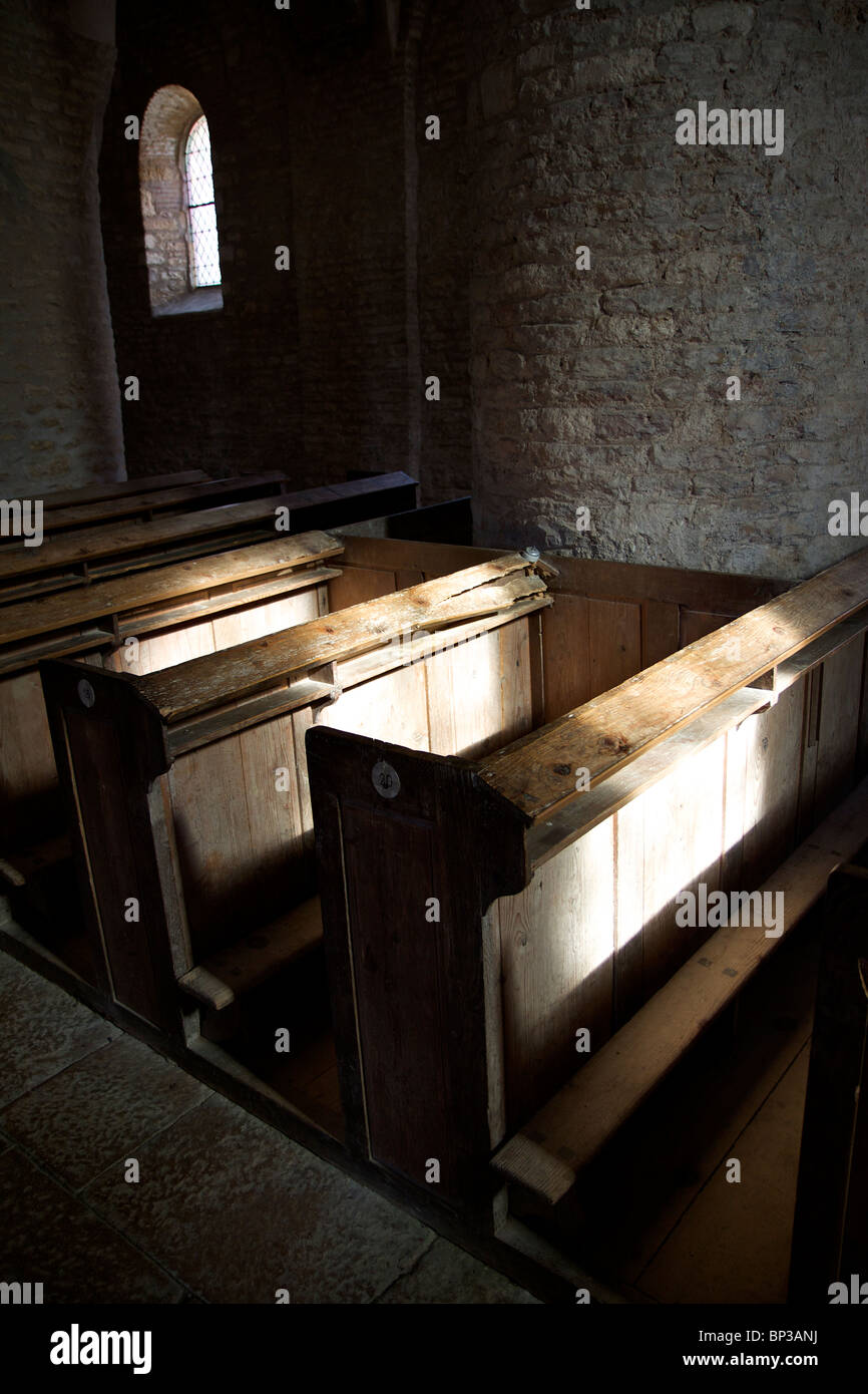 Empty pews in church bathed in sunlight Stock Photo - Alamy