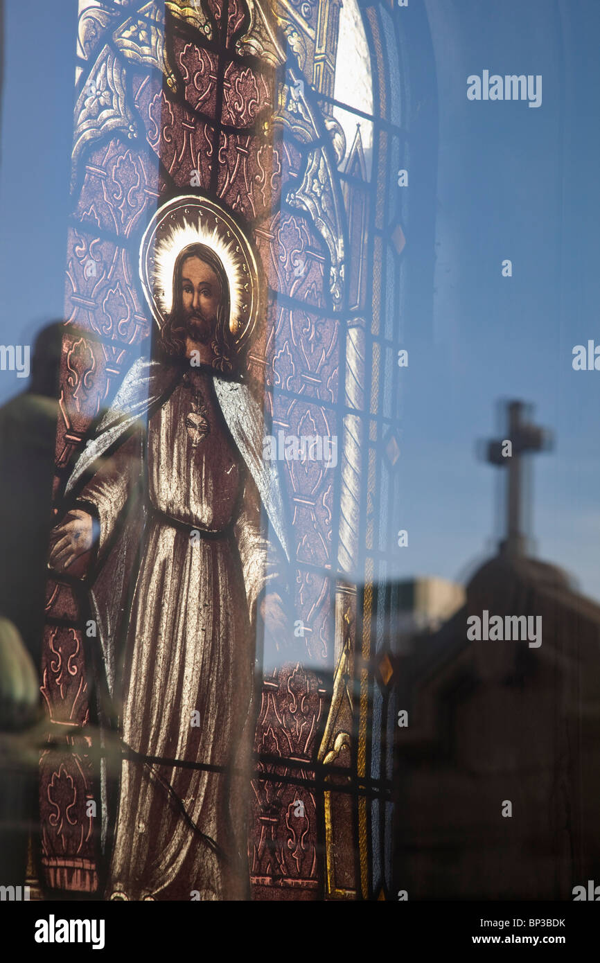 Buenos Aires Argentina A Stained Glass Window Depicting Jesus With A Reflection Of A Cross In