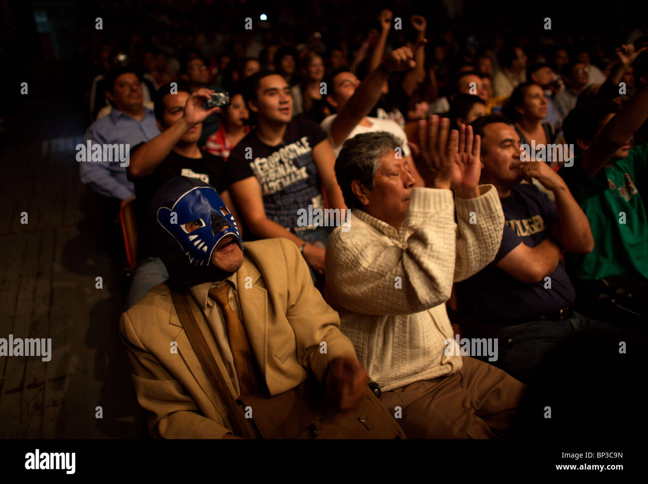 Fans cheer at a Lucha Libre Wrestling show at Arena Mexico in Mexico ...