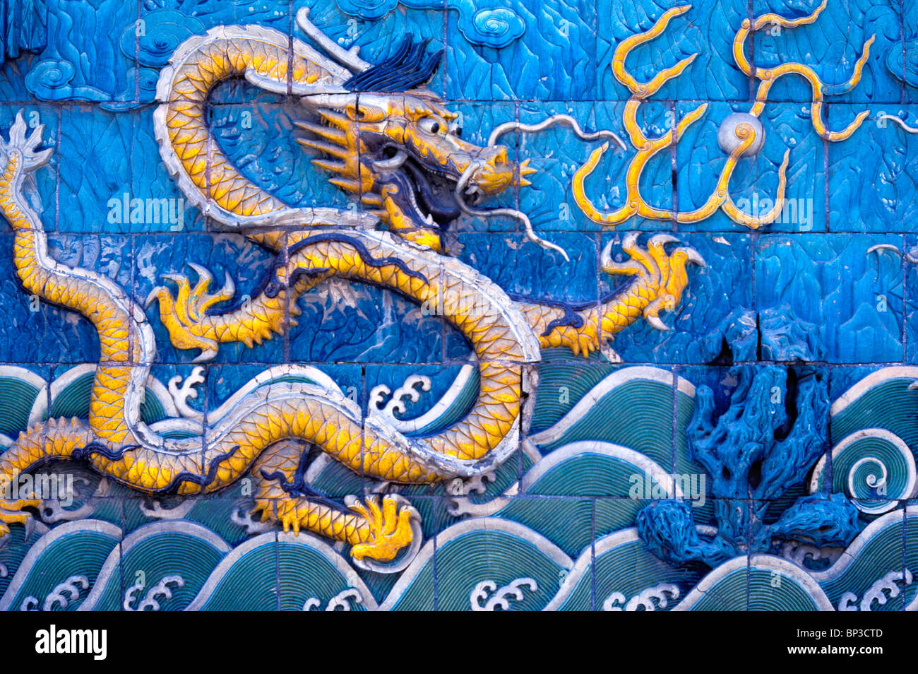 Asia China Beijing. Stylized dragons nearly jump from this tiled wall ...