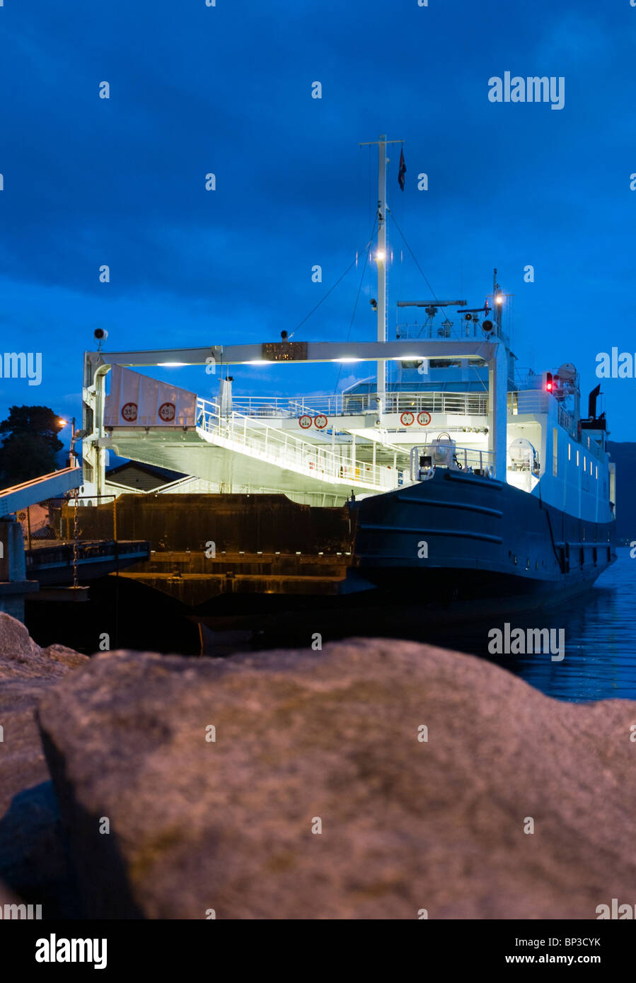 Ferry at night on the busy E39 in Norway. Waiting to take passengers ...