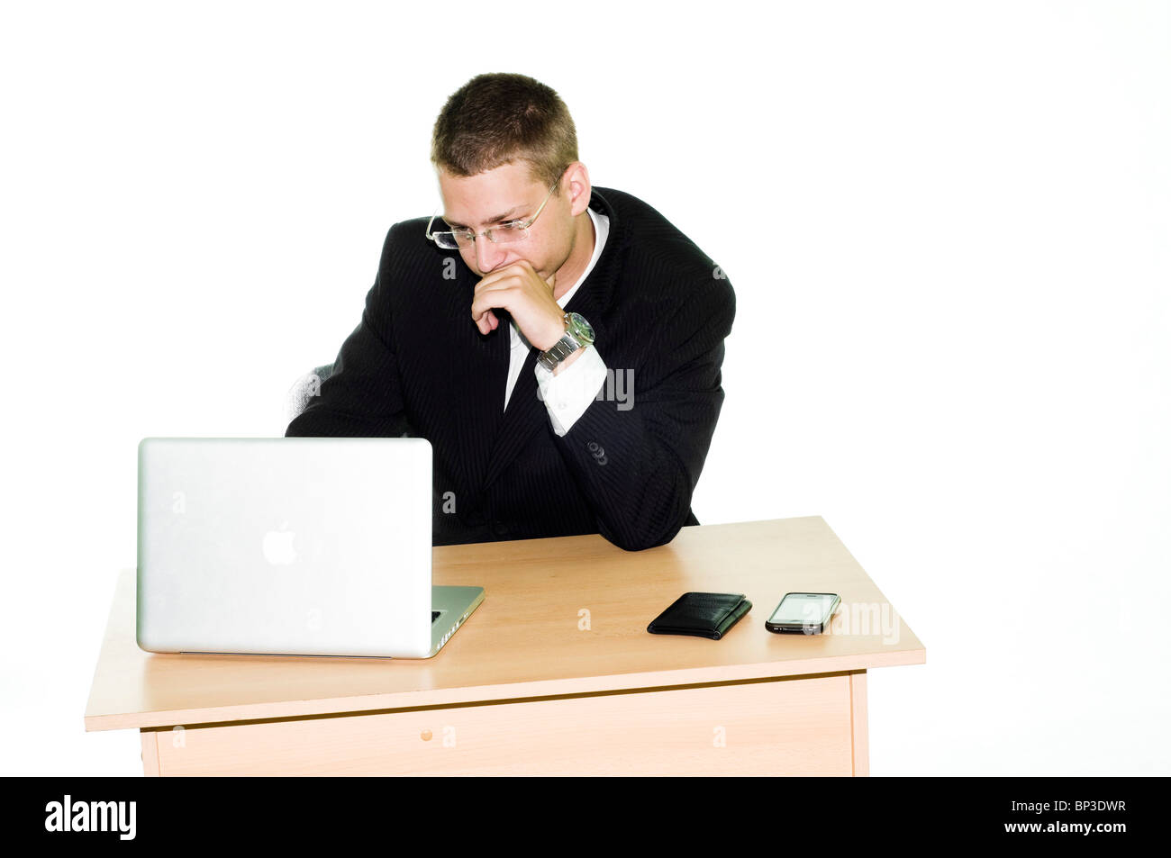 Young businessman working on a desk with Apple laptop - Macbook Pro 13 ...