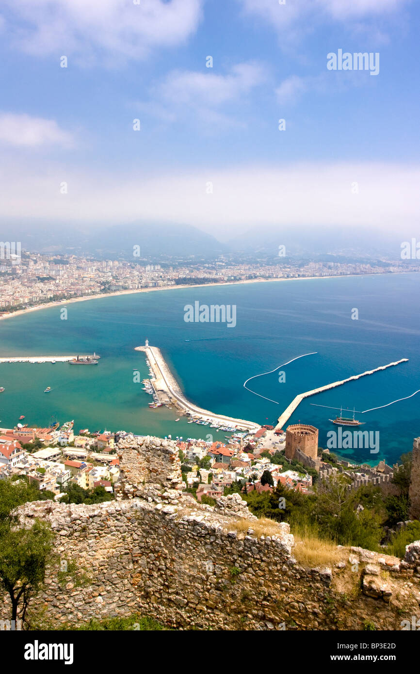 Stone wall ruins of Alanya Castle and view of harbor, Alanya, Turkey ...