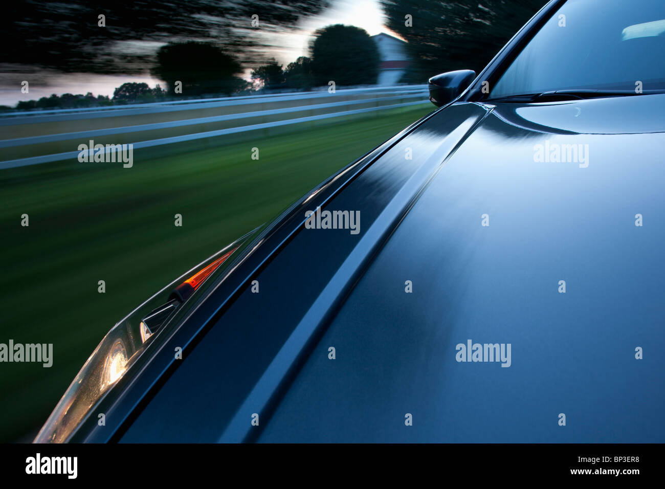 Front of a car moving down hiway Stock Photo - Alamy