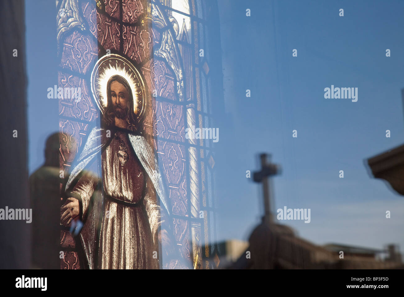 Buenos Aires Argentina A Stained Glass Window Depicting Jesus With A Reflection Of A Cross In