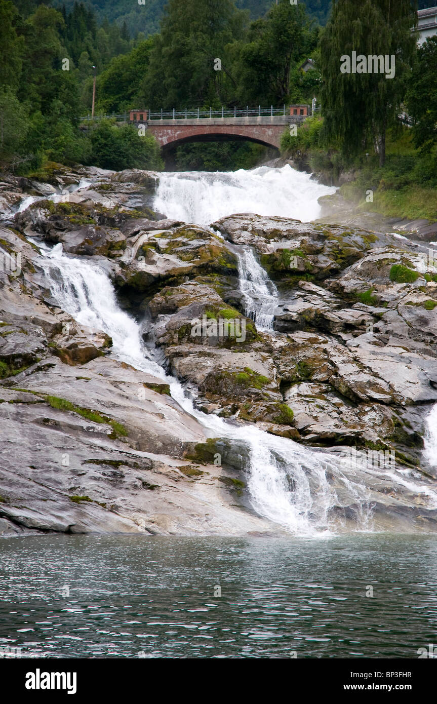 The waterfall through Hellesylt, Stranda, Norway, a small ferry port ...