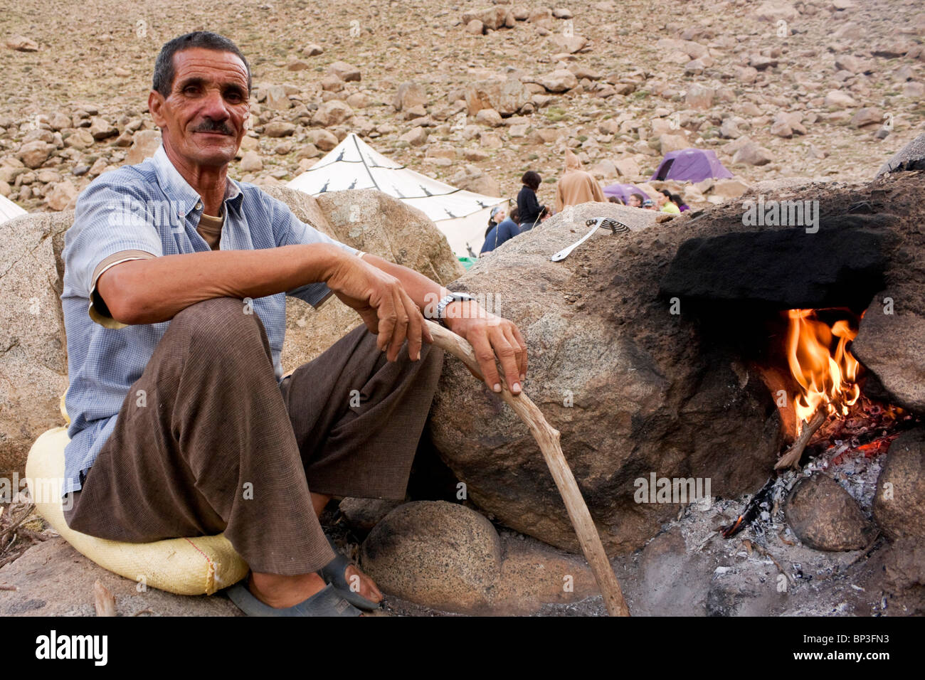 Man baking bread in Atlas Mountains Stock Photo - Alamy