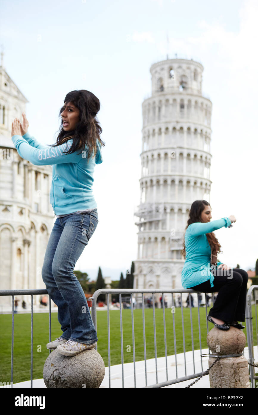 Tourists posing with the Leaning Tower of Pisa in Pisa, Italy Stock ...