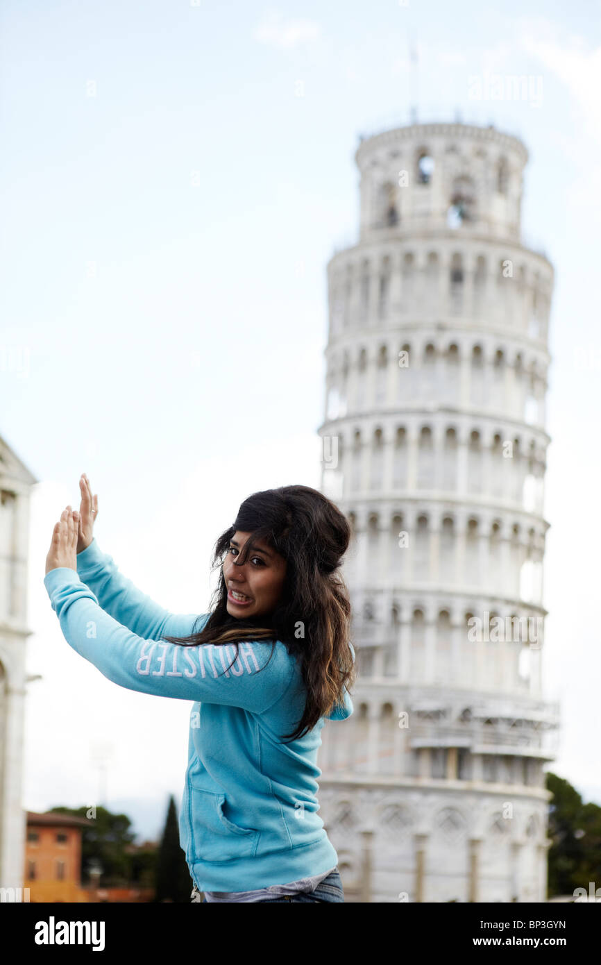 Tourist posing with the Leaning Tower of Pisa in Pisa, Italy Stock ...