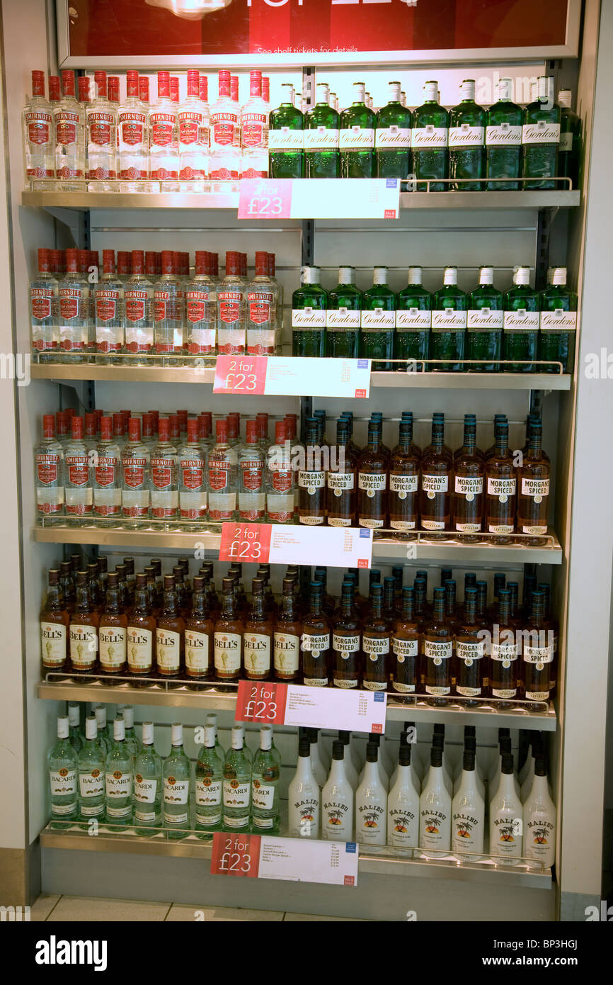 Bottles of alcohol on display in cabinet Stock Photo - Alamy