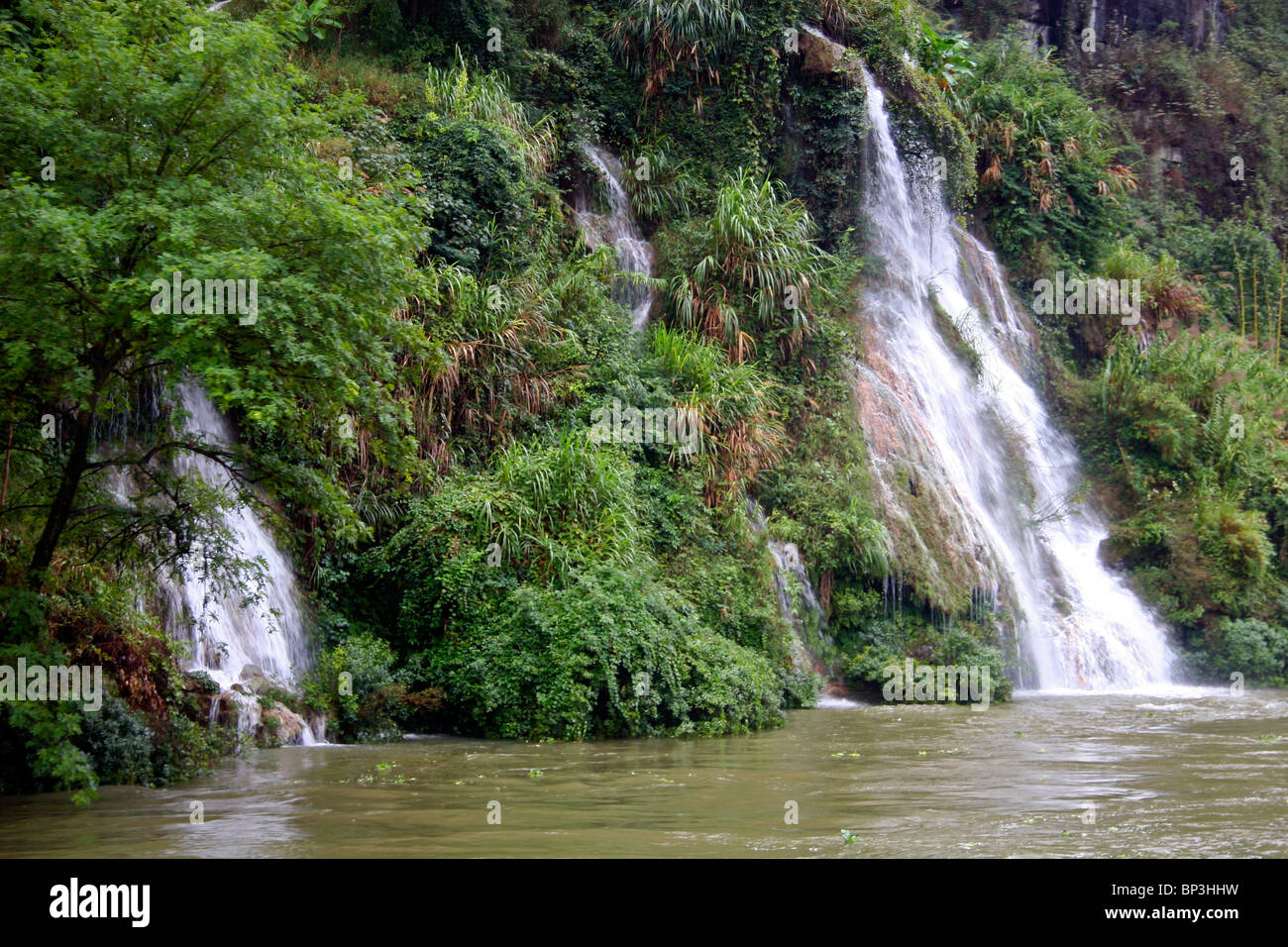 China, Guangxi, Guilin, Li River. Waterfalls dot the misty scenery of ...