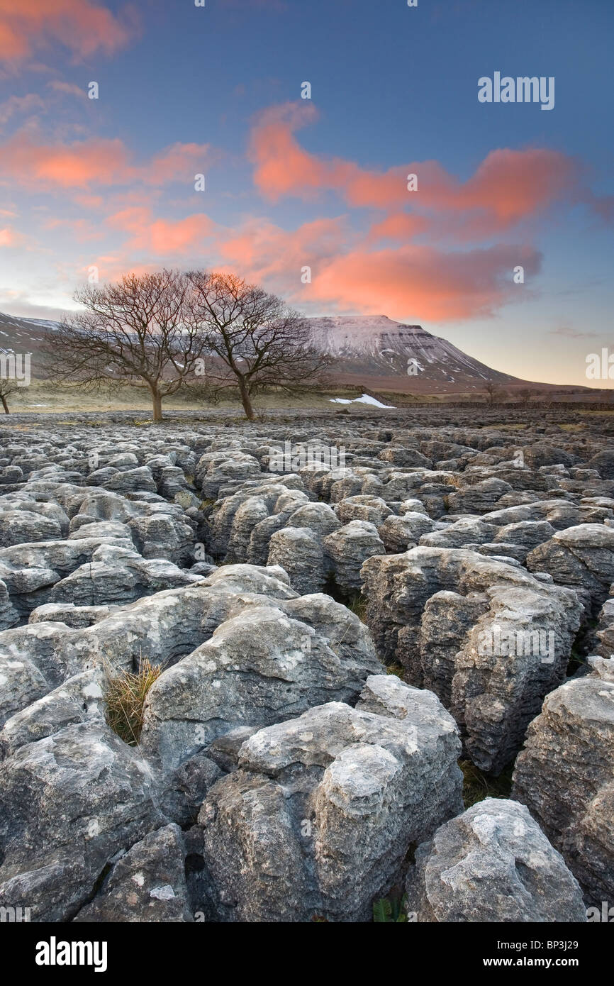Limestone pavement at the foot of snow capped Ingleborough Hill at ...