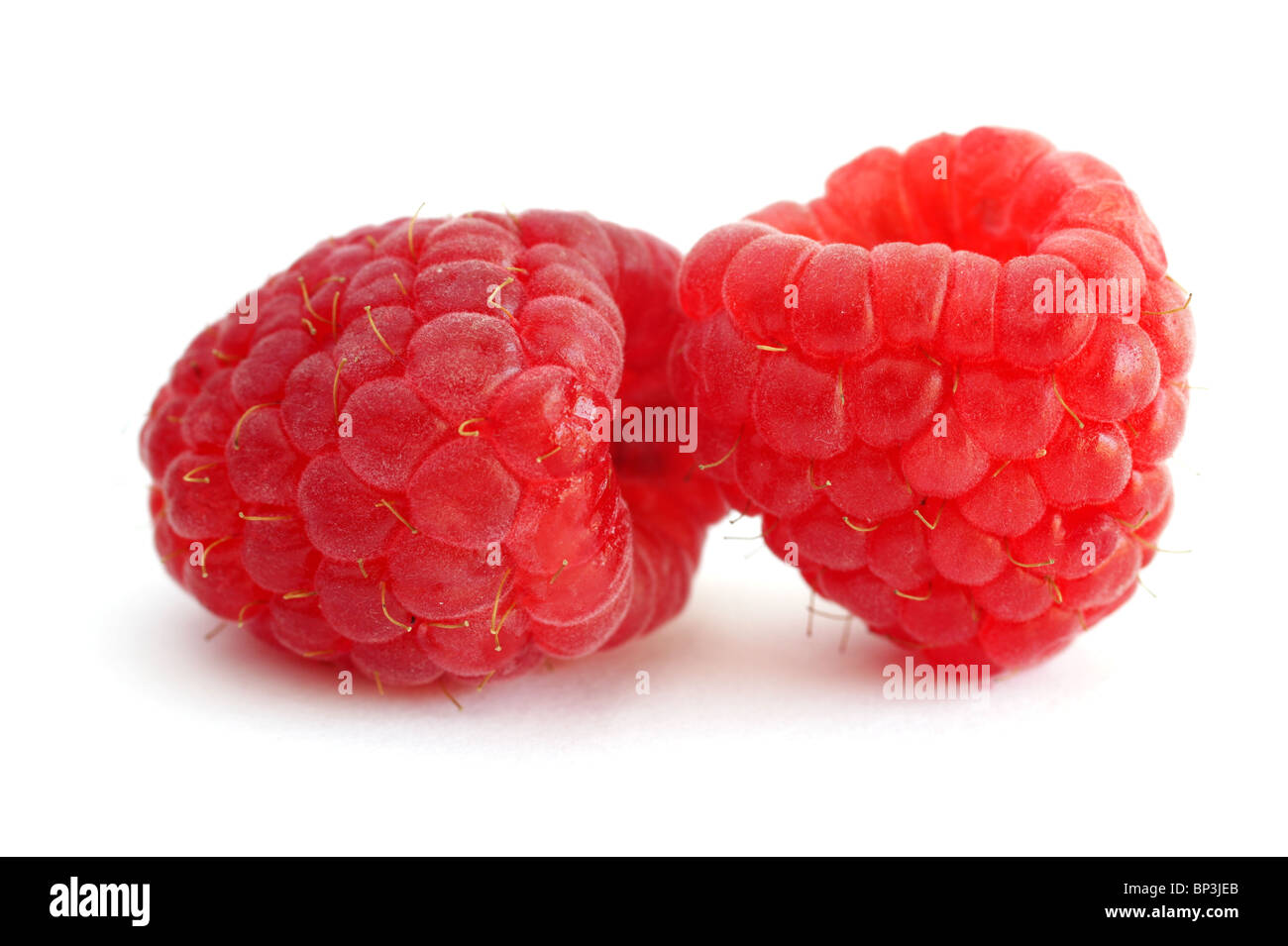 Two raspberries over white background (studio shot Stock Photo - Alamy