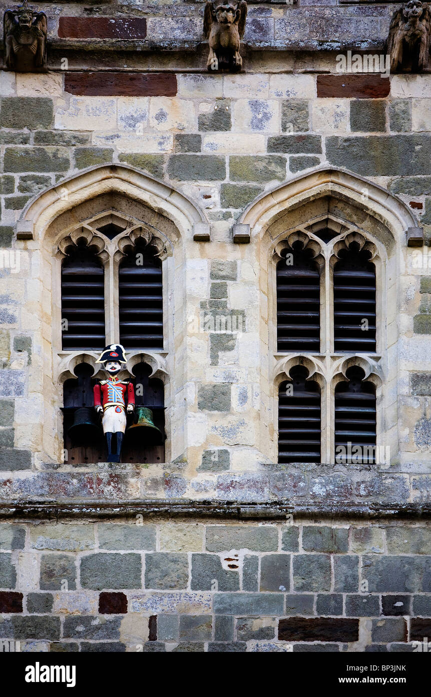 Low viewpoint of the west tower of Wimborne Minster viewed in autumn ...