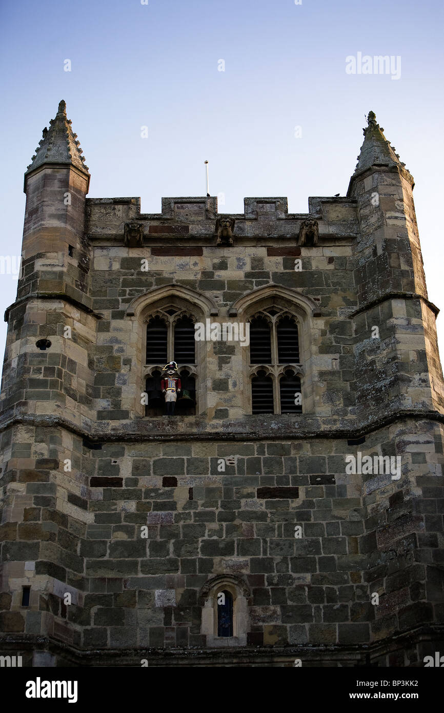 Low viewpoint of the west tower of Wimborne Minster viewed in autumn ...