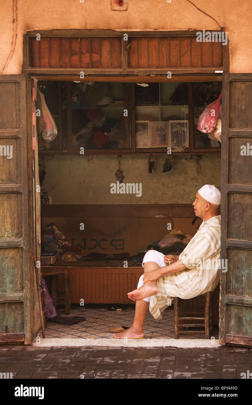 Old man sitting in shop in Marrakech Stock Photo - Alamy