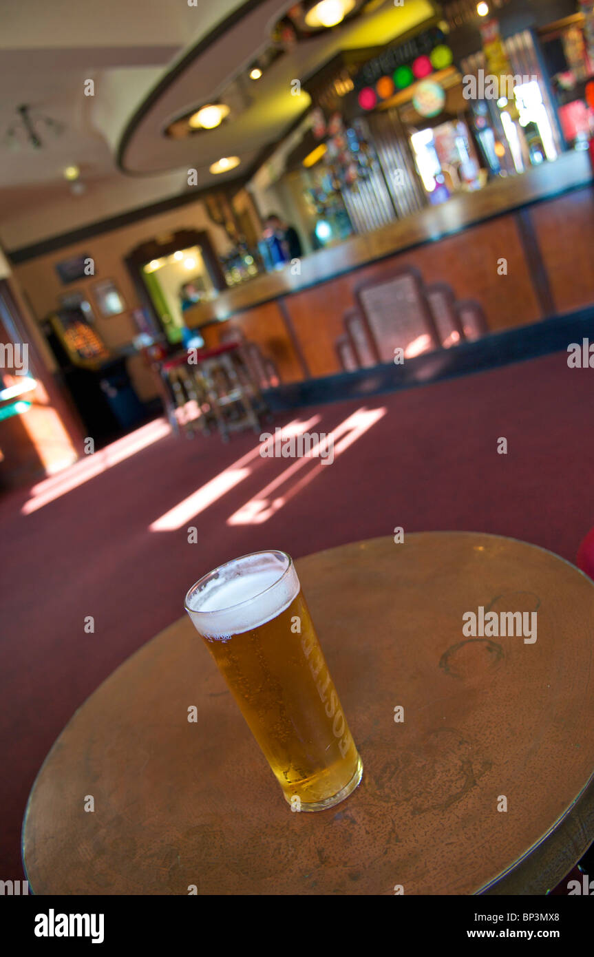 English Pub interior showing art deco bar with table and drink in ...