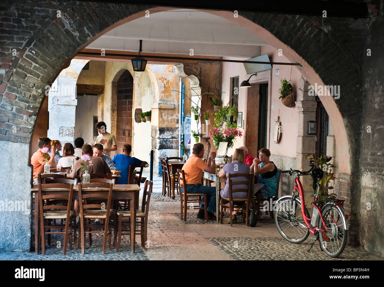 People eating outdoors at traditional trattoria, Verona Italy Stock ...