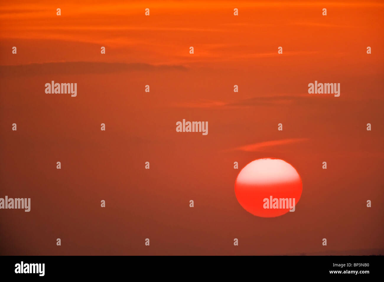 Sun in red sky at sunset, Serengeti National Park, Tanzania, Africa ...