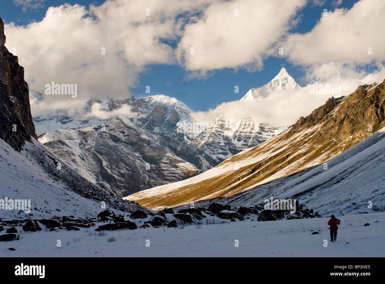 Bhutanese Guide at Sophu Lake with view of Mt. Jichu Drake on Jhomalari ...