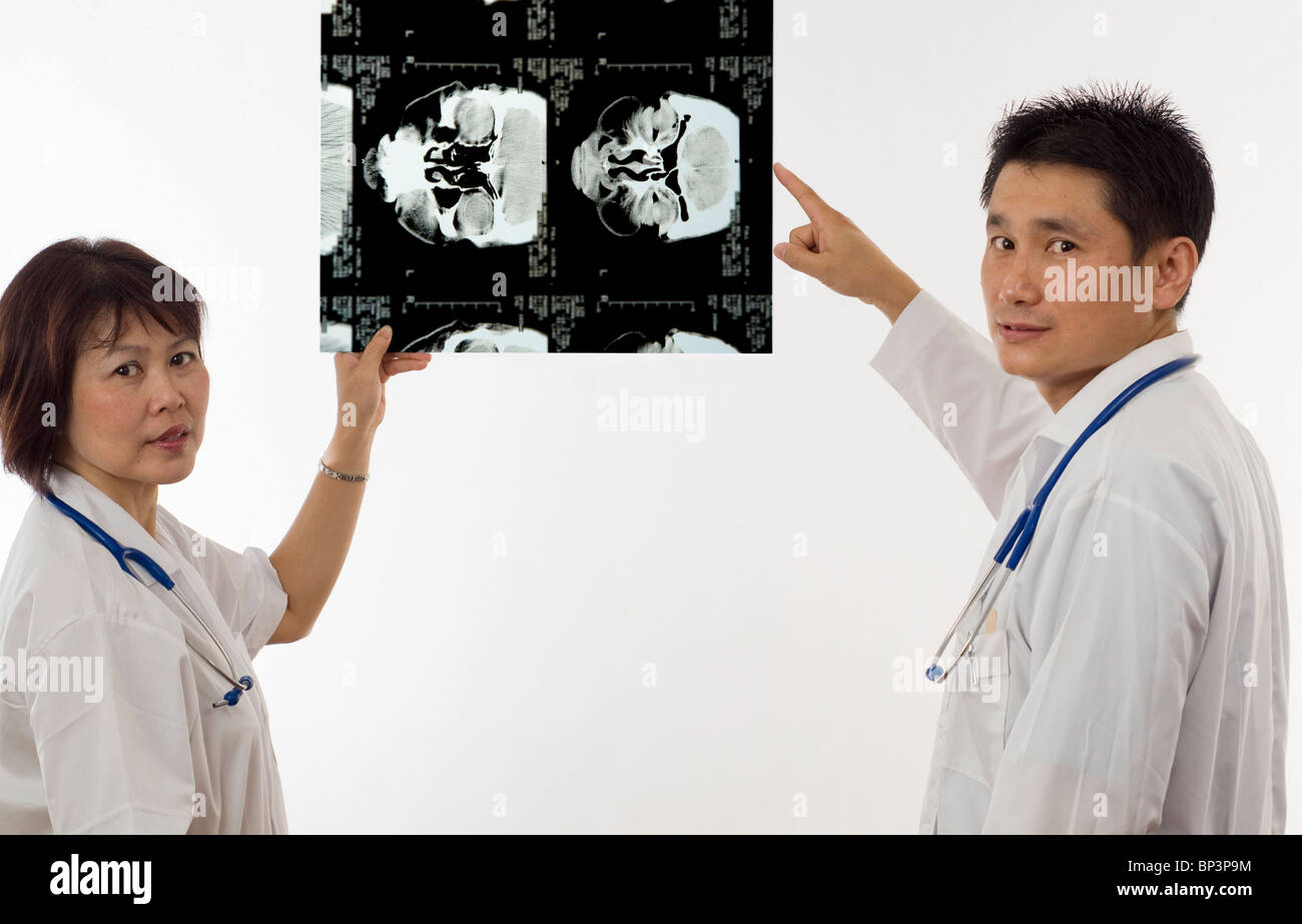 Doctor and Nurse standing with patients MRI scan Stock Photo - Alamy