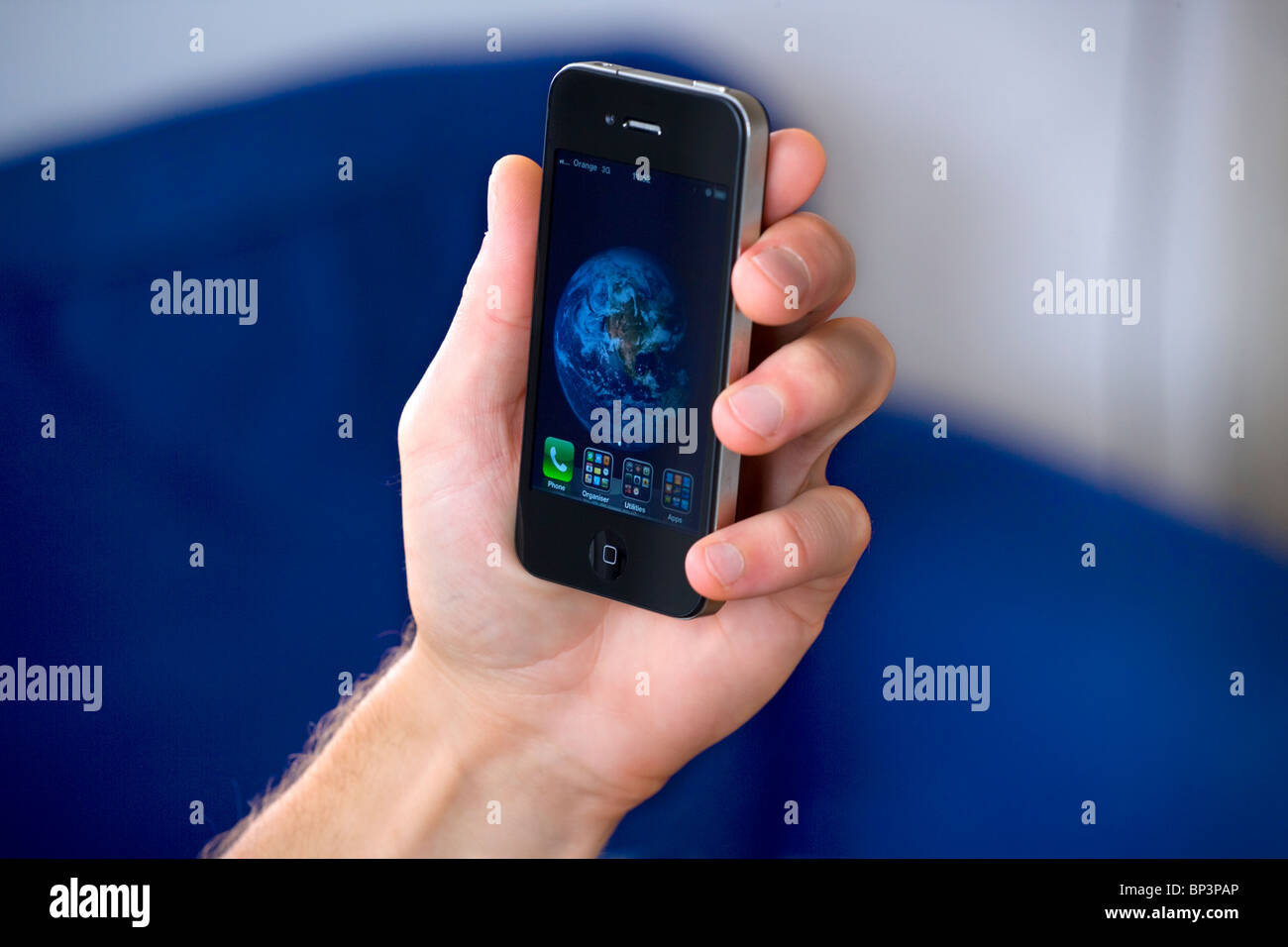 Iphone in blue hi-res stock photography and images - Alamy