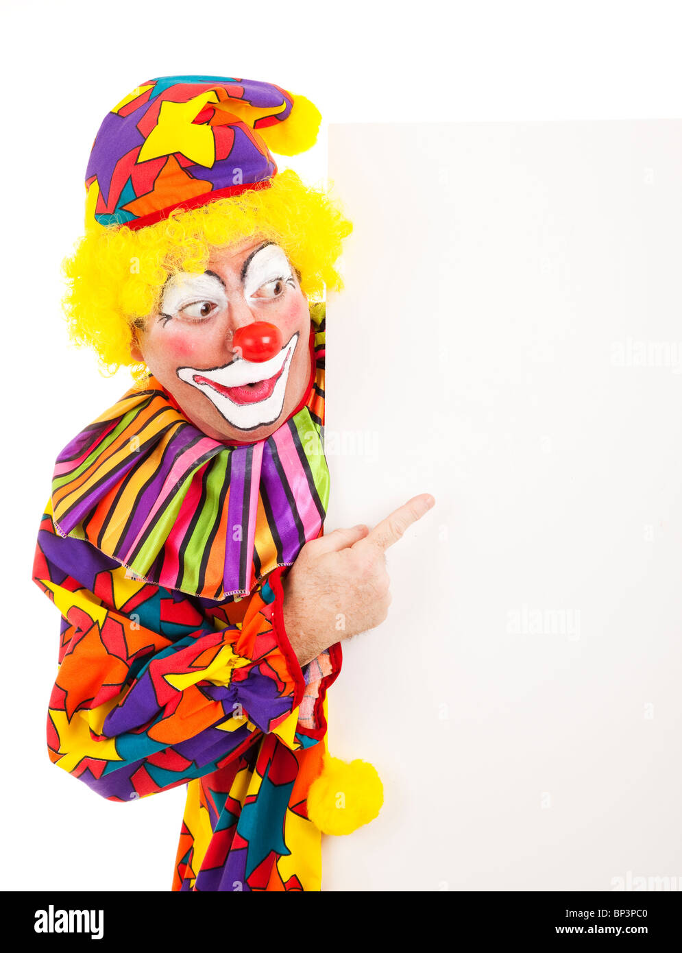 Circus clown pointing at a blank white space. Isolated design element ...