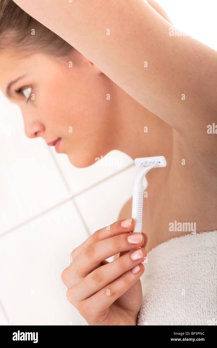 Blond woman shaving armpit in hi-res stock photography and images - Alamy