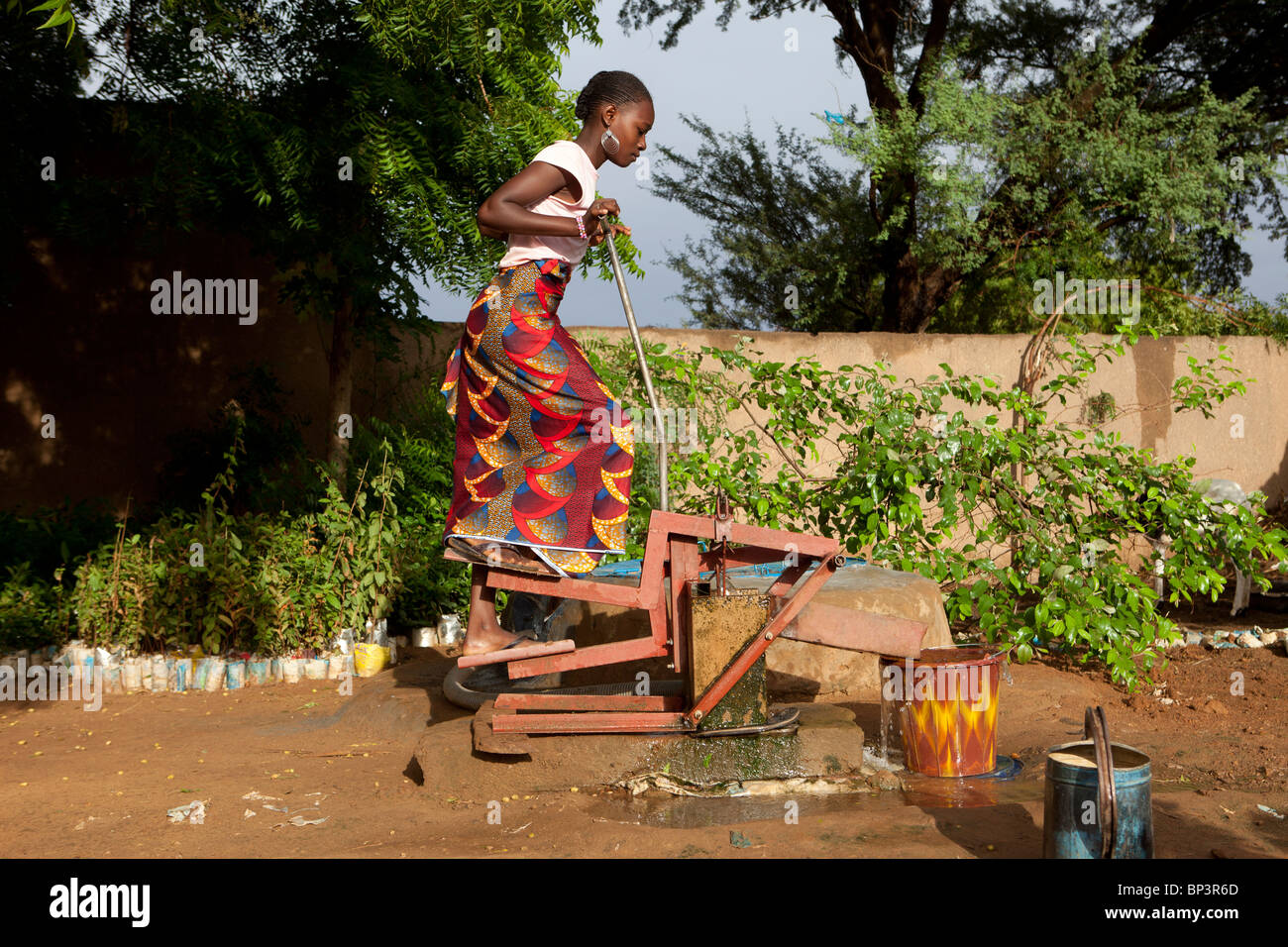GUIDAN IDER VILLAGE, NEAR KONNI, NIGER, 27TH JULY 2010: Working a foot ...