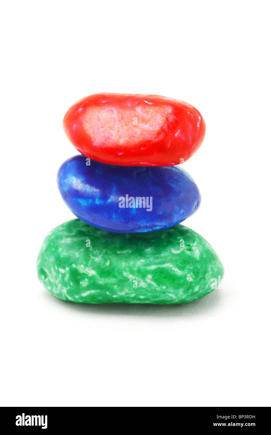 Stack of colored pebble stones on white background Stock Photo - Alamy