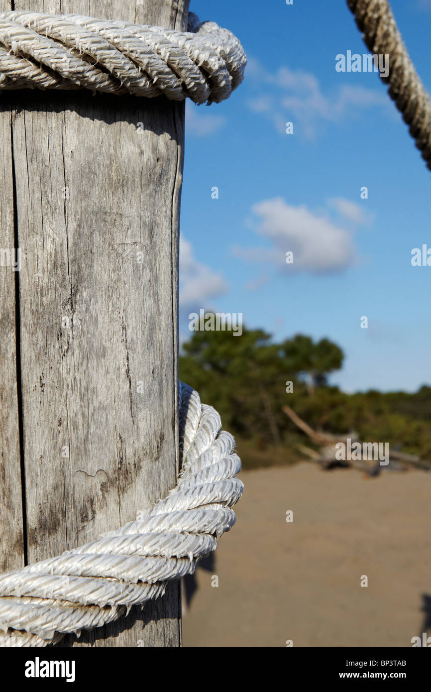 Rope on a wooden post at a beach in Follonica, Italy Stock Photo - Alamy