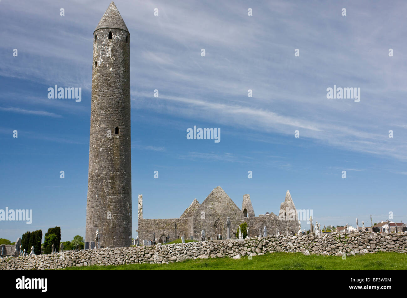 Kilmacduagh monastery or Cathedral, with ancient leaning round tower ...